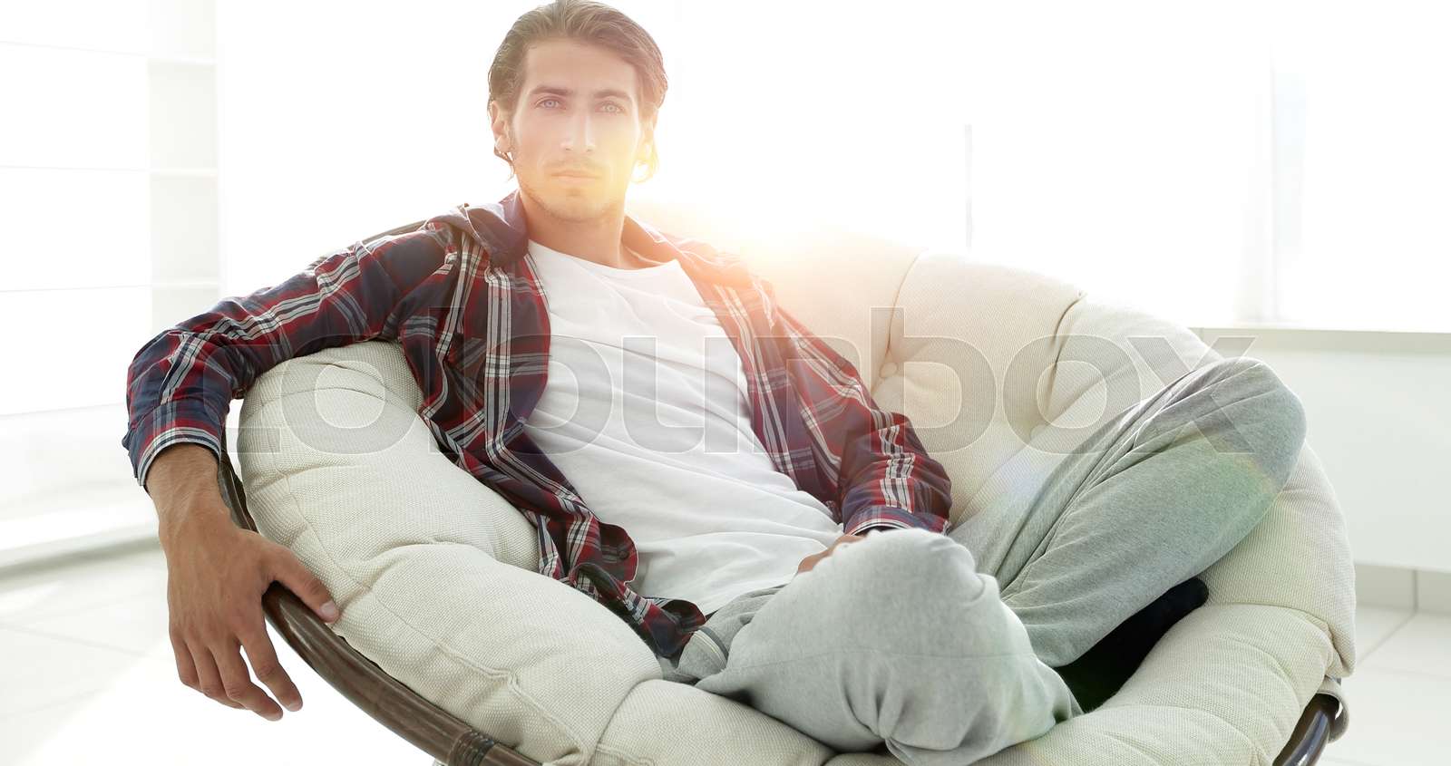 successful guy resting in modern living room. | Stock image | Colourbox