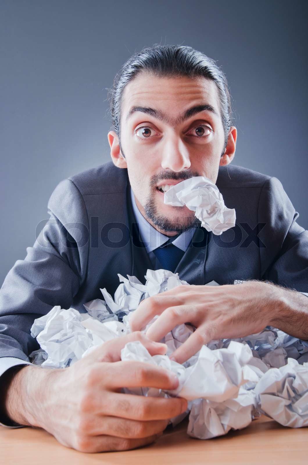 Businessman throwing paper away | Stock image | Colourbox