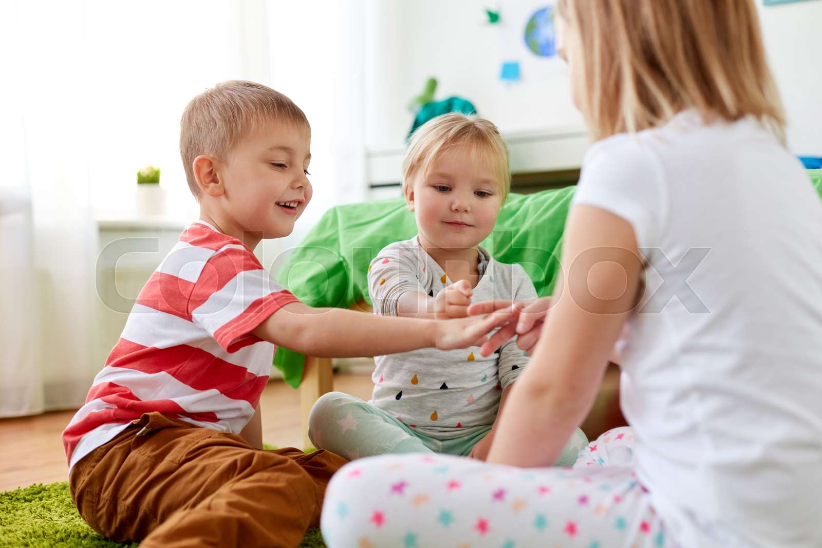 kids playing rock-paper-scissors game at home | Stock image | Colourbox