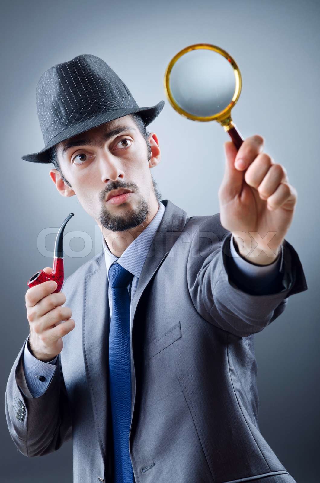 Detective med ryge pibe | Stock foto | Colourbox