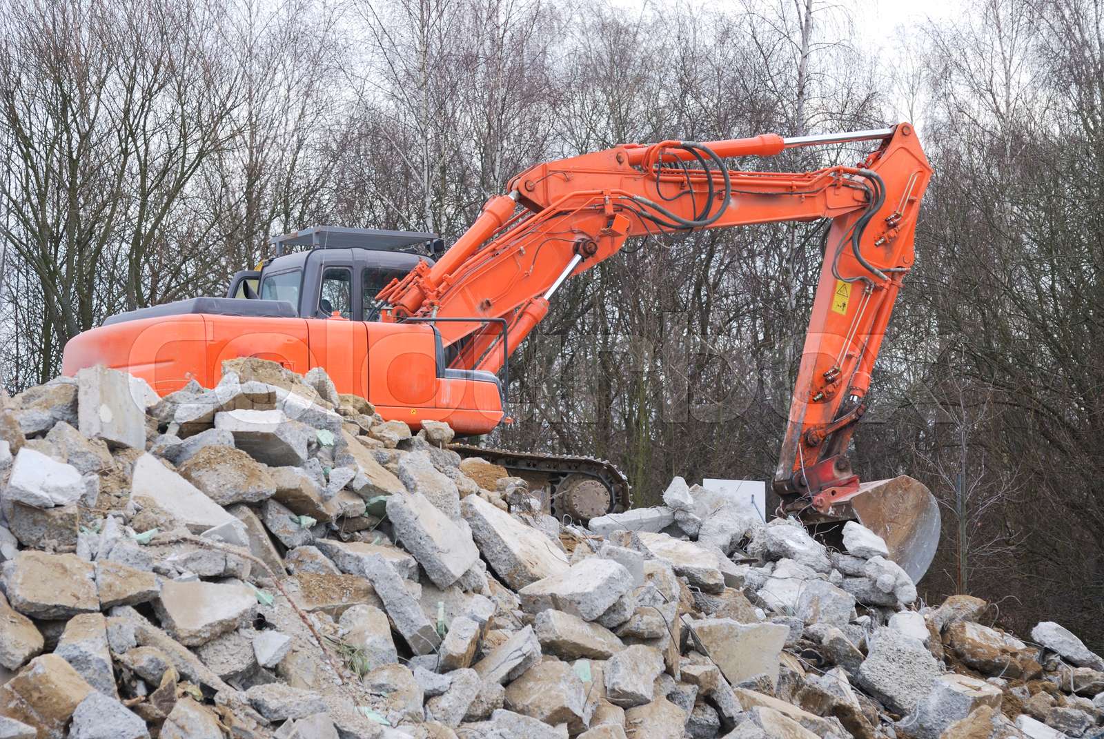 Demolition with an digger | Stock image | Colourbox