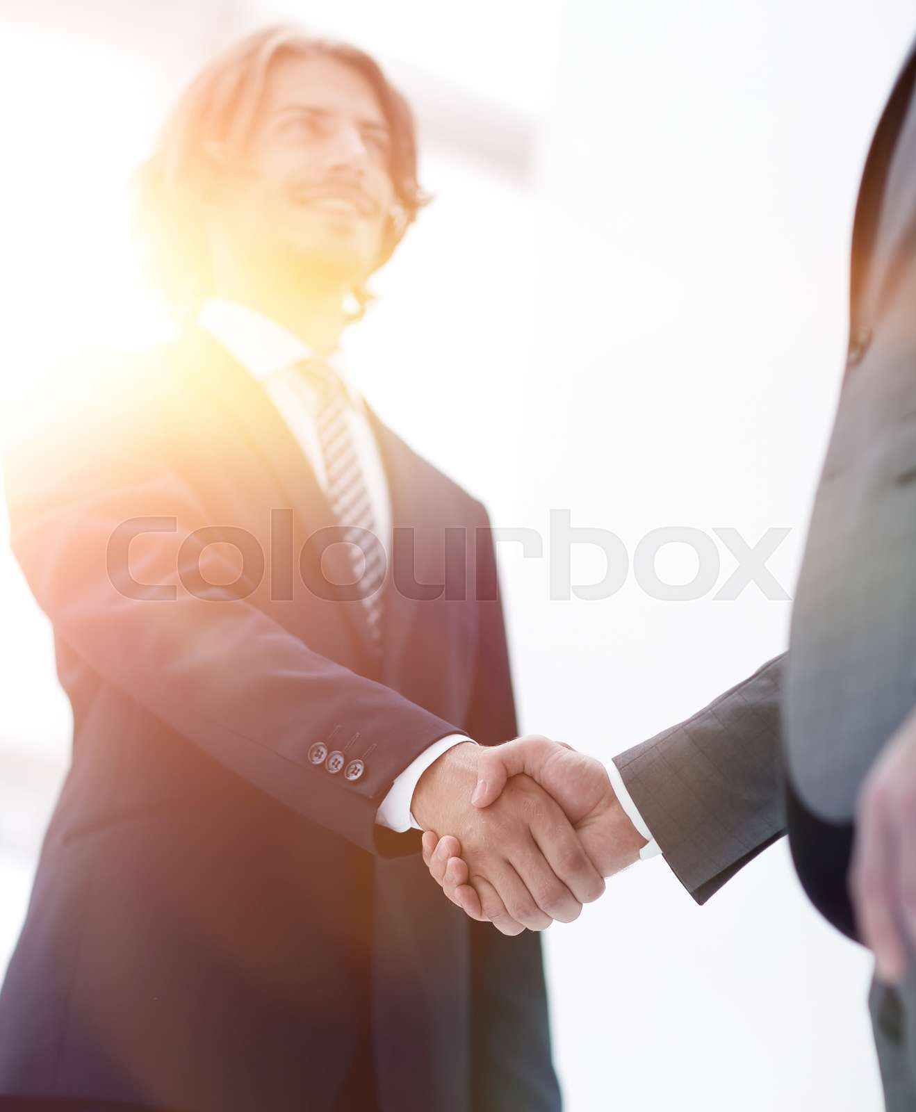 Closeup of a business handshake | Stock image | Colourbox