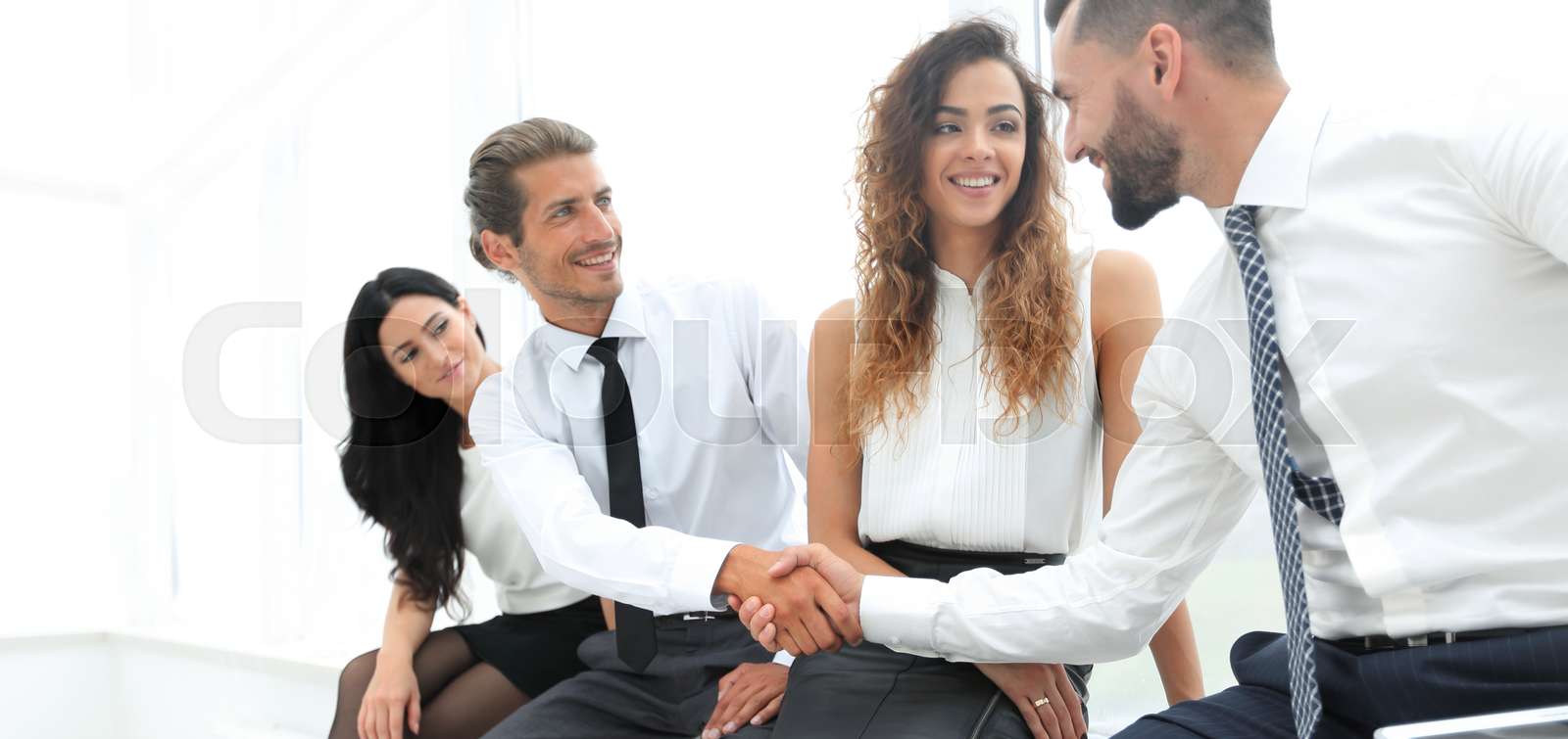 welcome handshake between two colleagues. | Stock image | Colourbox
