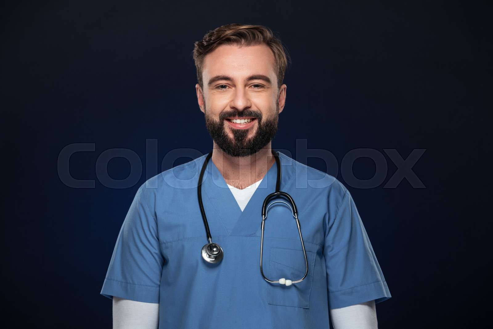 Portrait Of A Cheerful Male Doctor Stock Image Colourbox