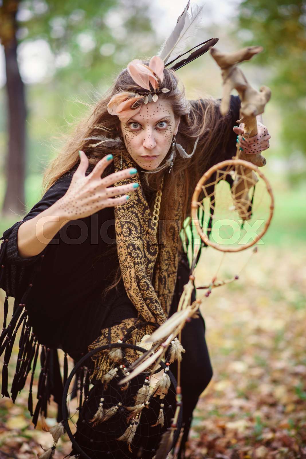 Shaman tribal woman casting ritual magic in nature | Stock image | Colourbox