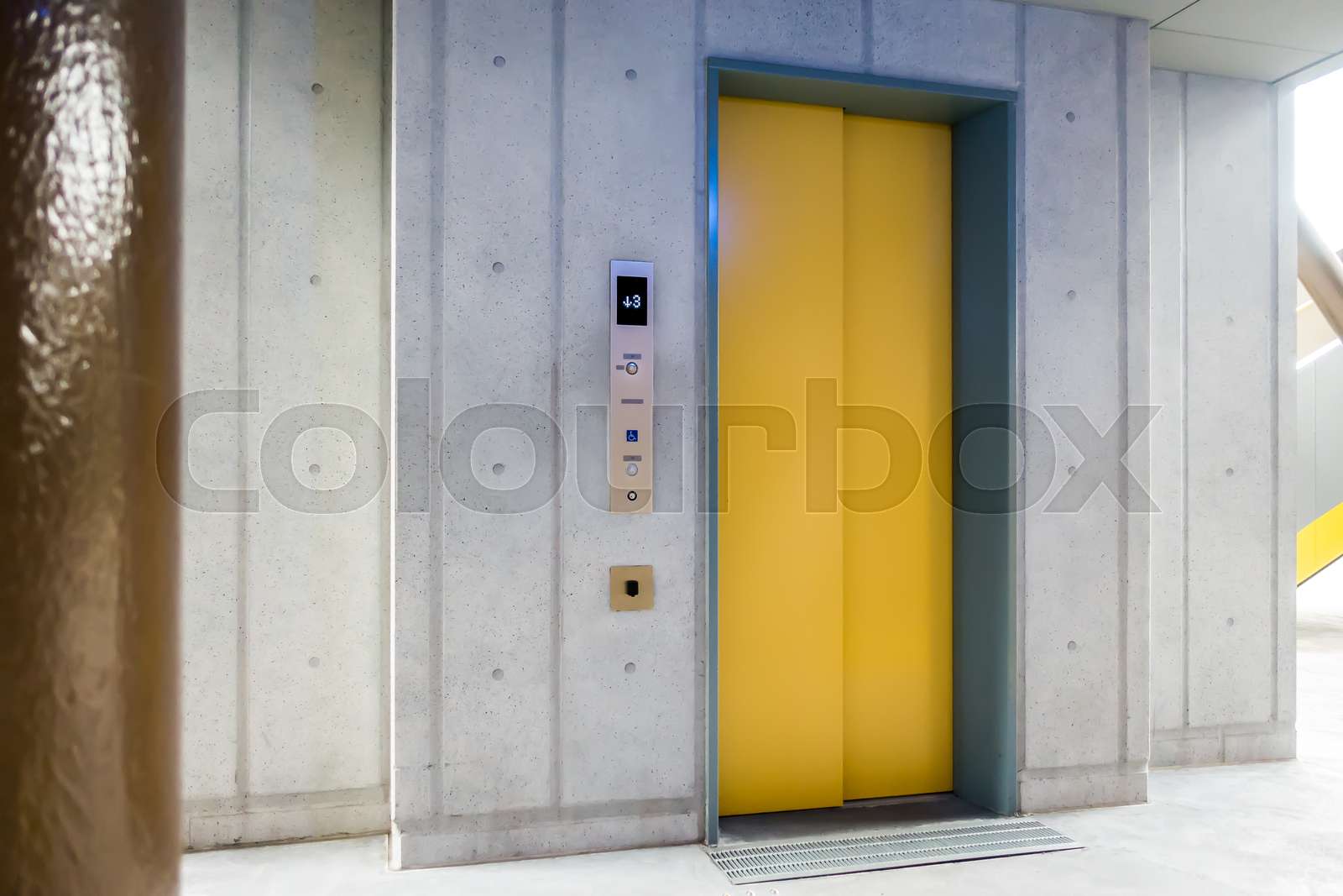 Yellow elevator door closed | Stock image | Colourbox