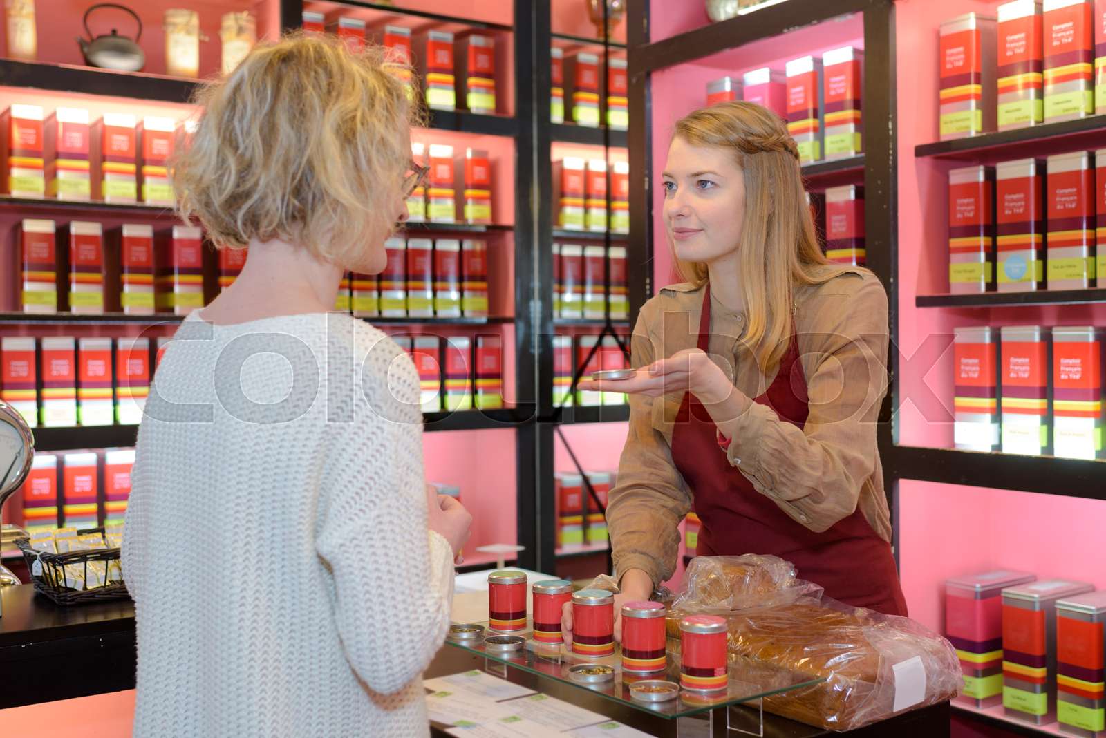 woman choosing tea in grocery store | Stock image | Colourbox