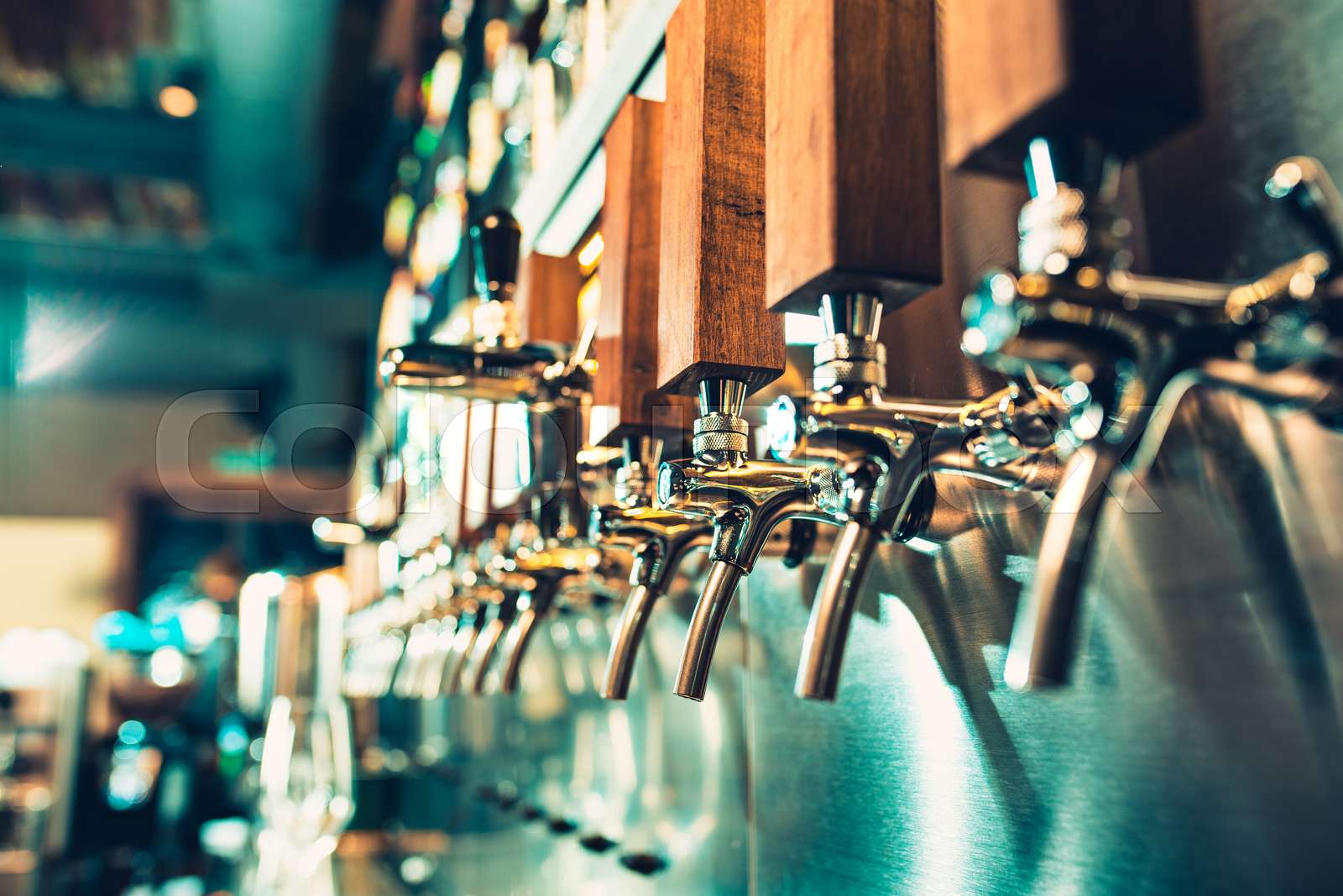 Beer taps in a pub | Stock image | Colourbox
