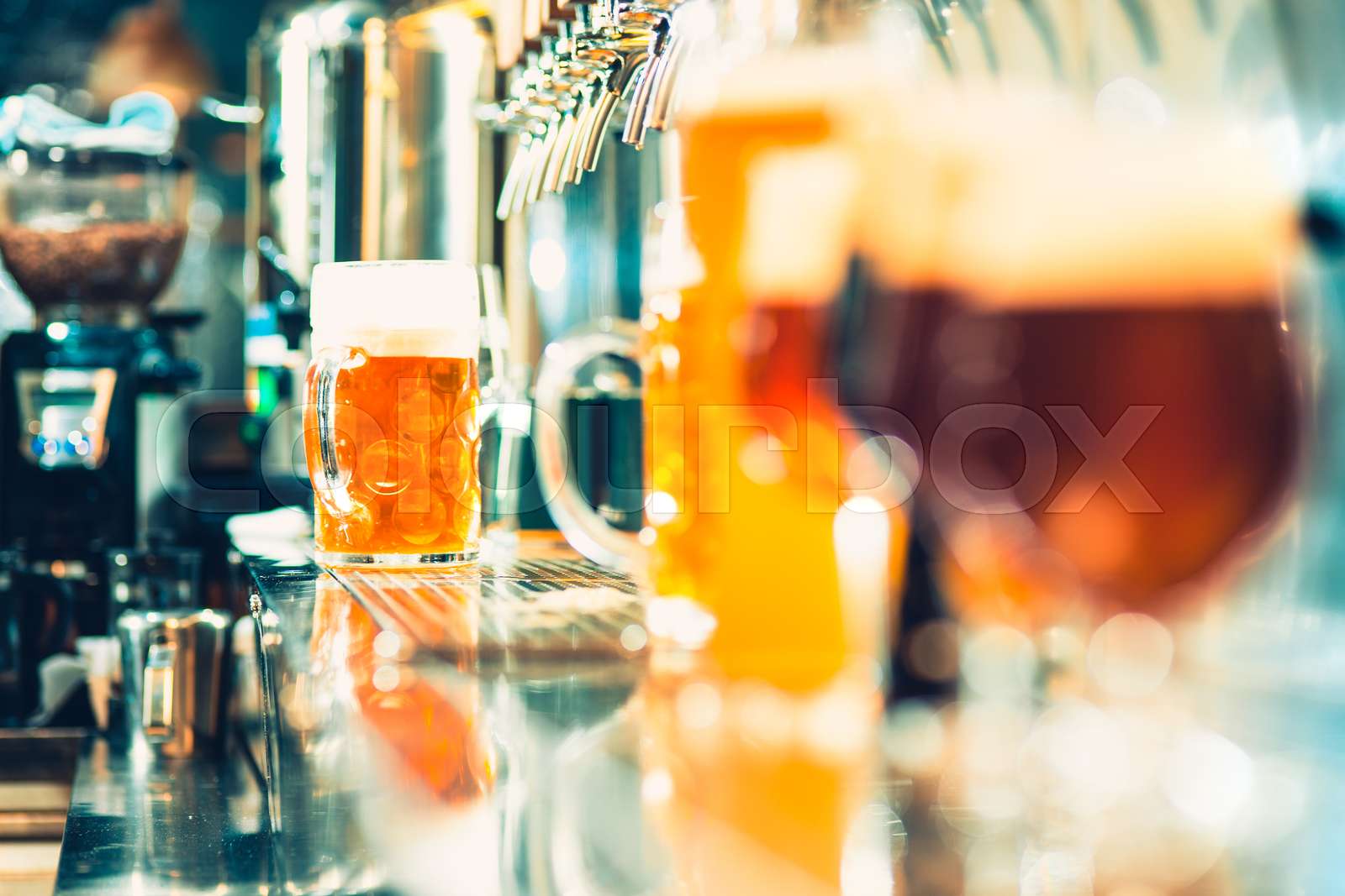 Beer taps in a pub | Stock image | Colourbox