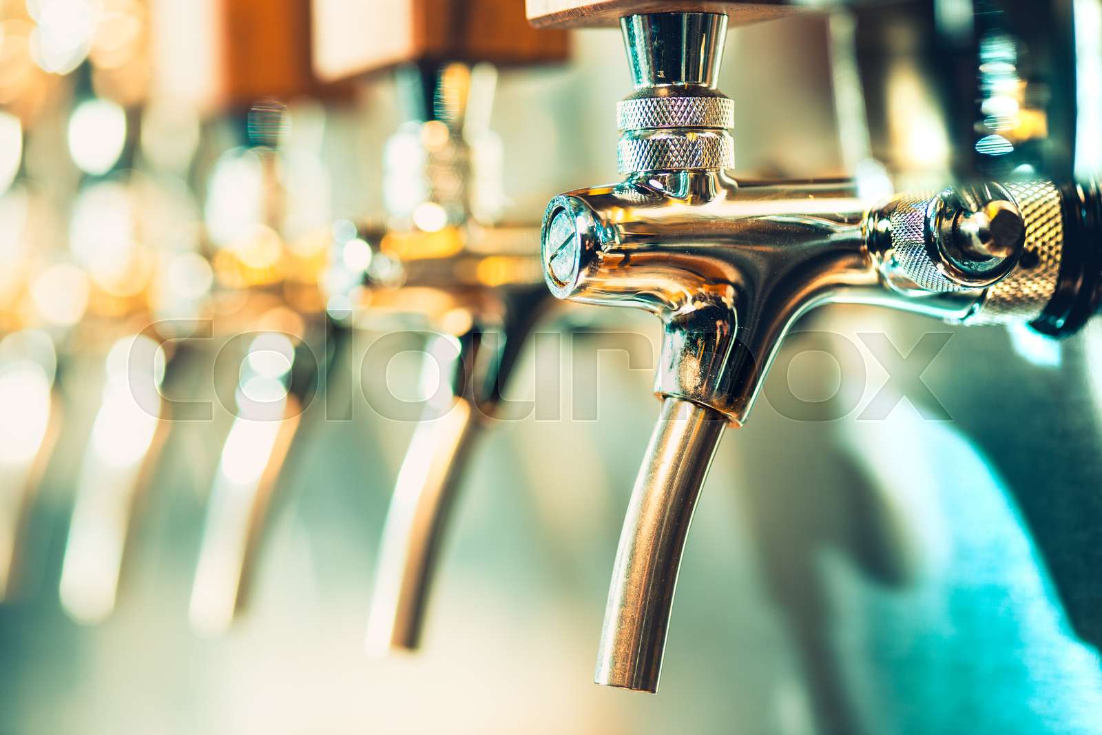 Beer taps in a pub | Stock image | Colourbox