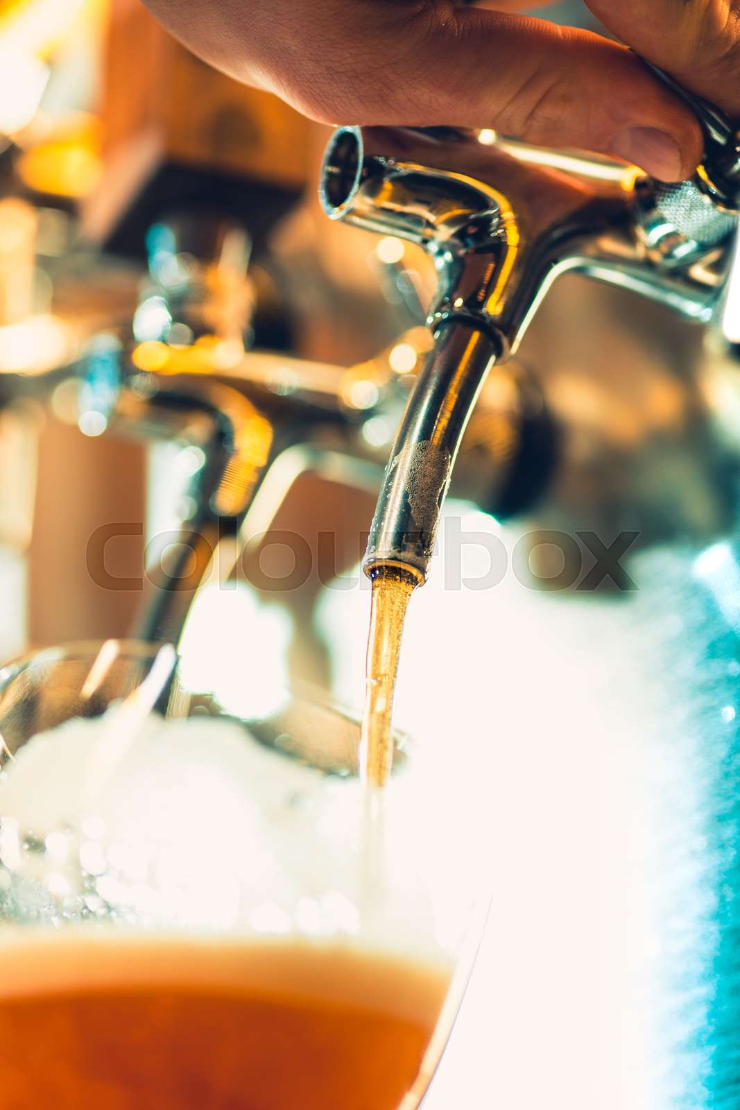 Beer taps in a pub | Stock image | Colourbox