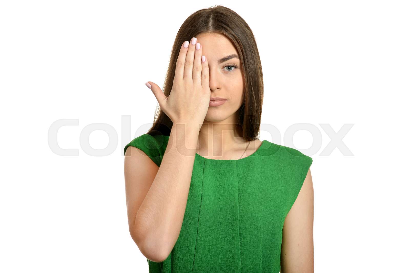 Woman closing one eye | Stock image | Colourbox