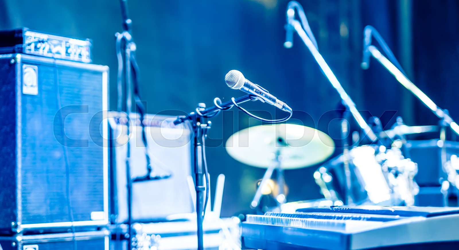 Microphone and synthesizer on stage | Stock image | Colourbox