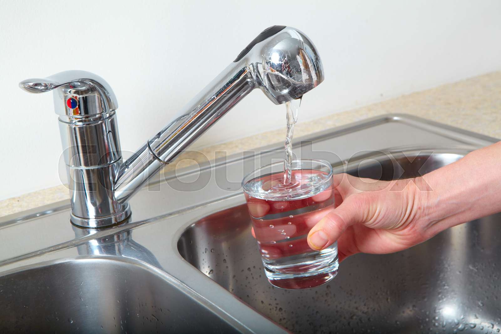 Filling glass of water | Stock image | Colourbox