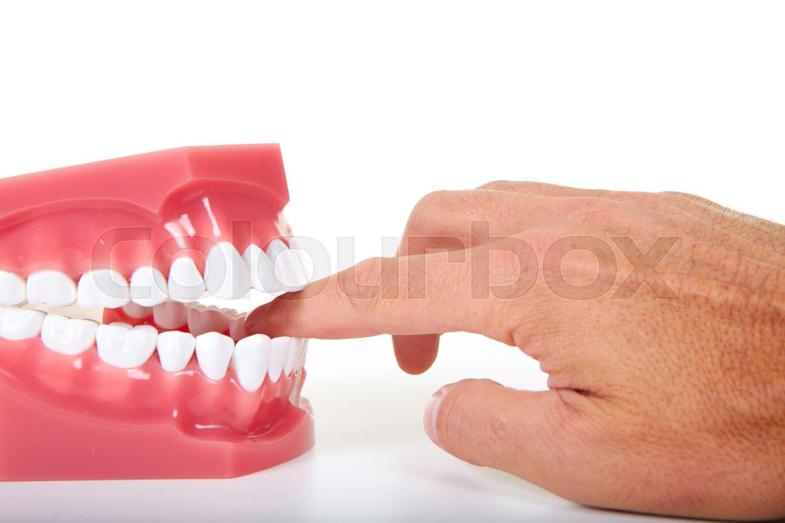 Fingers and teeth | Stock image | Colourbox