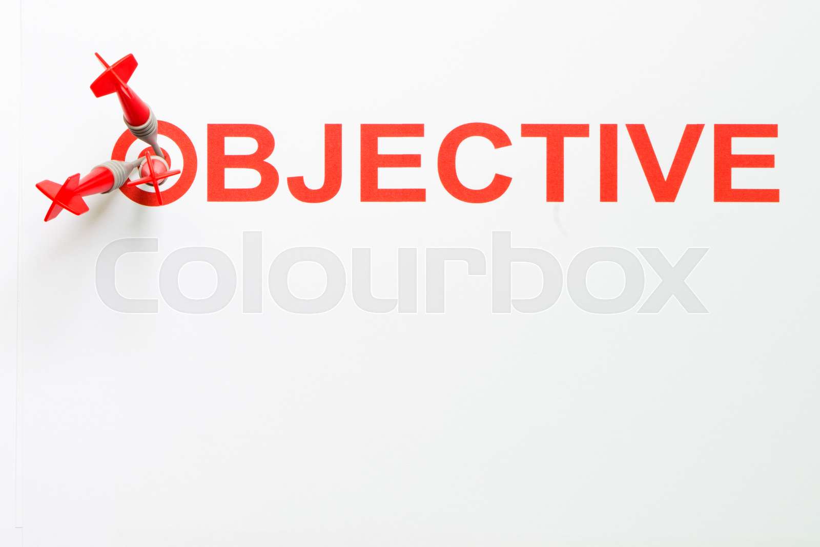 Objective text with dart on target | Stock image | Colourbox