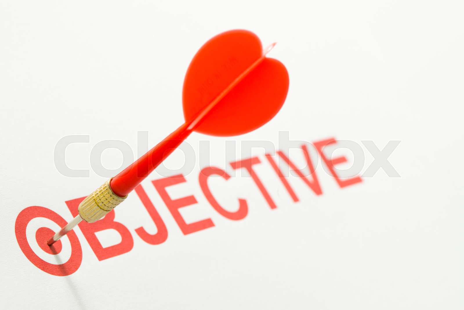 Objective text with dart on target | Stock image | Colourbox
