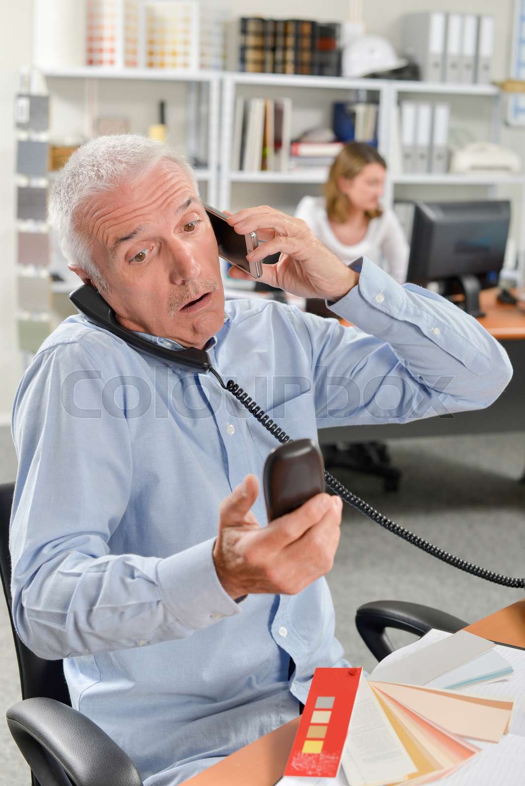 Stressed senior office worker | Stock image | Colourbox