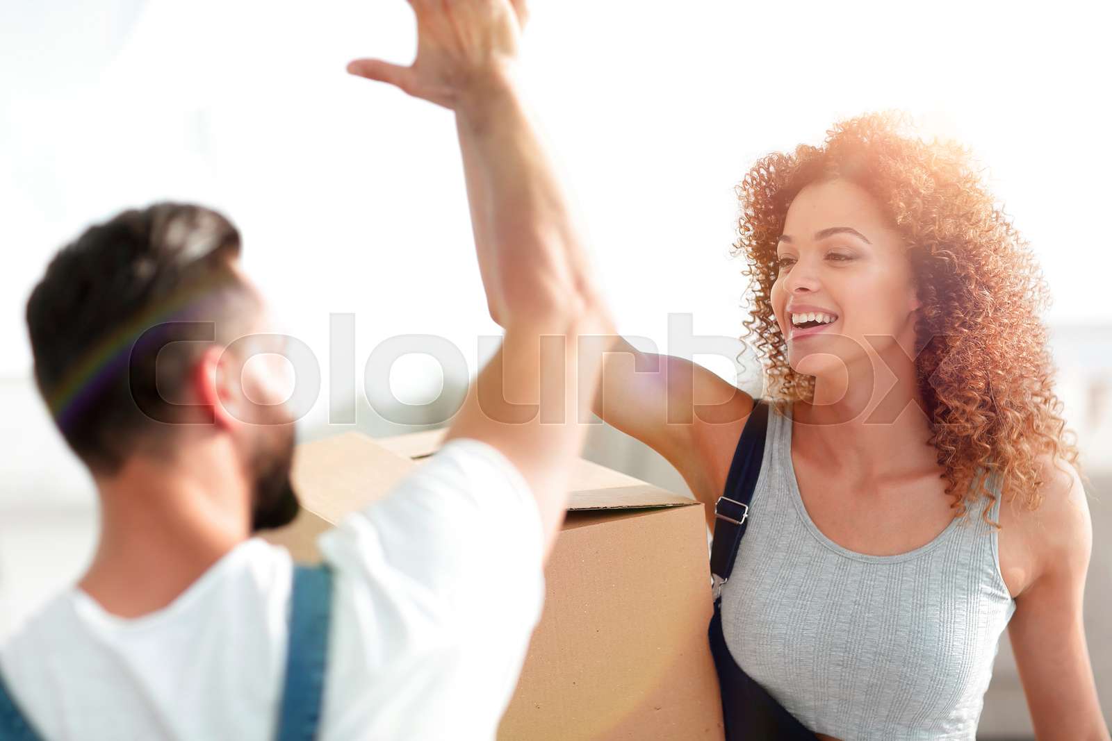 Happy and young couple giving a high five | Stock image | Colourbox