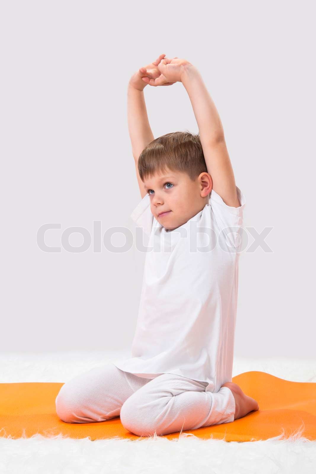 The little boy does exercise | Stock image | Colourbox