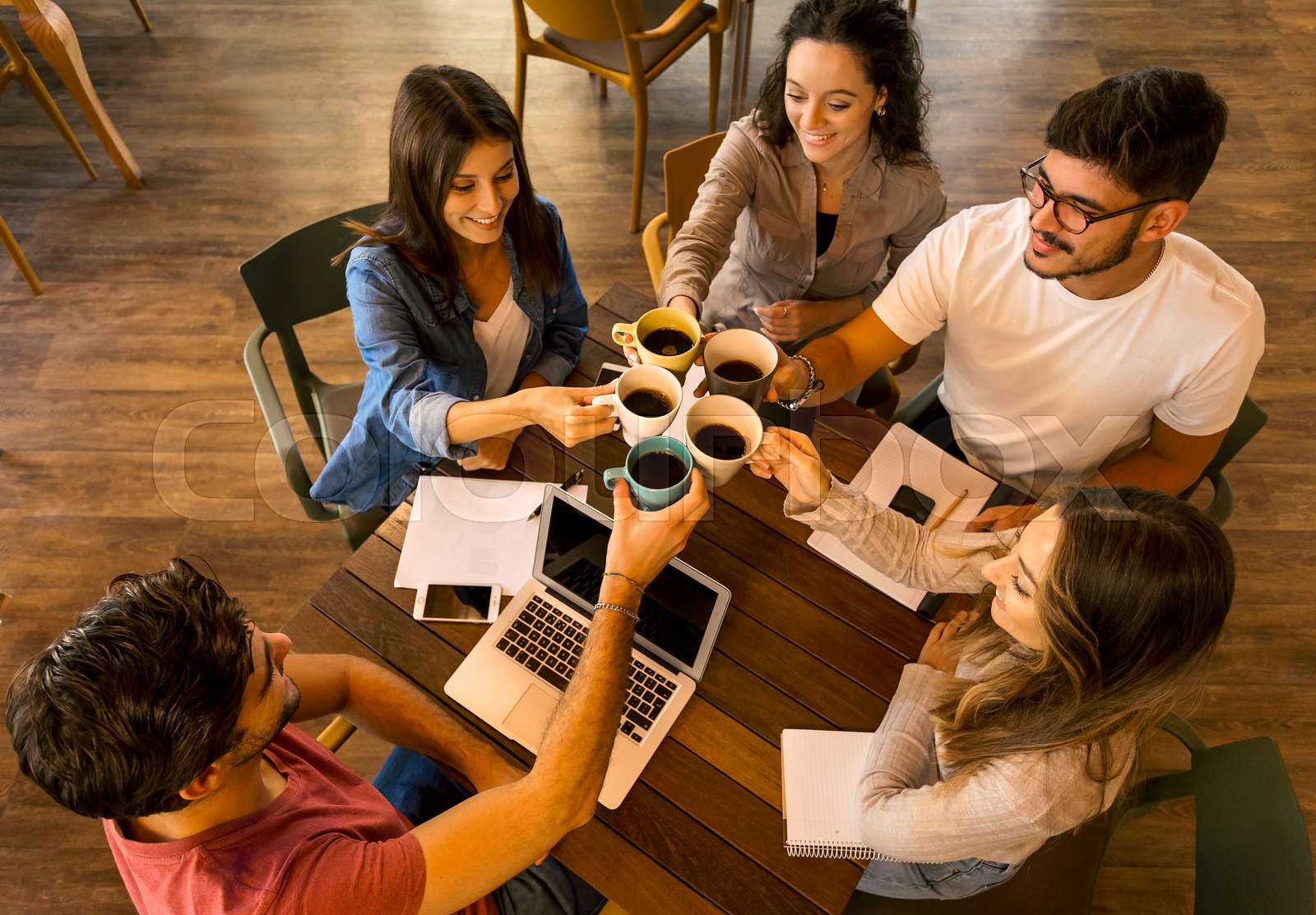 Students making a toast | Stock image | Colourbox
