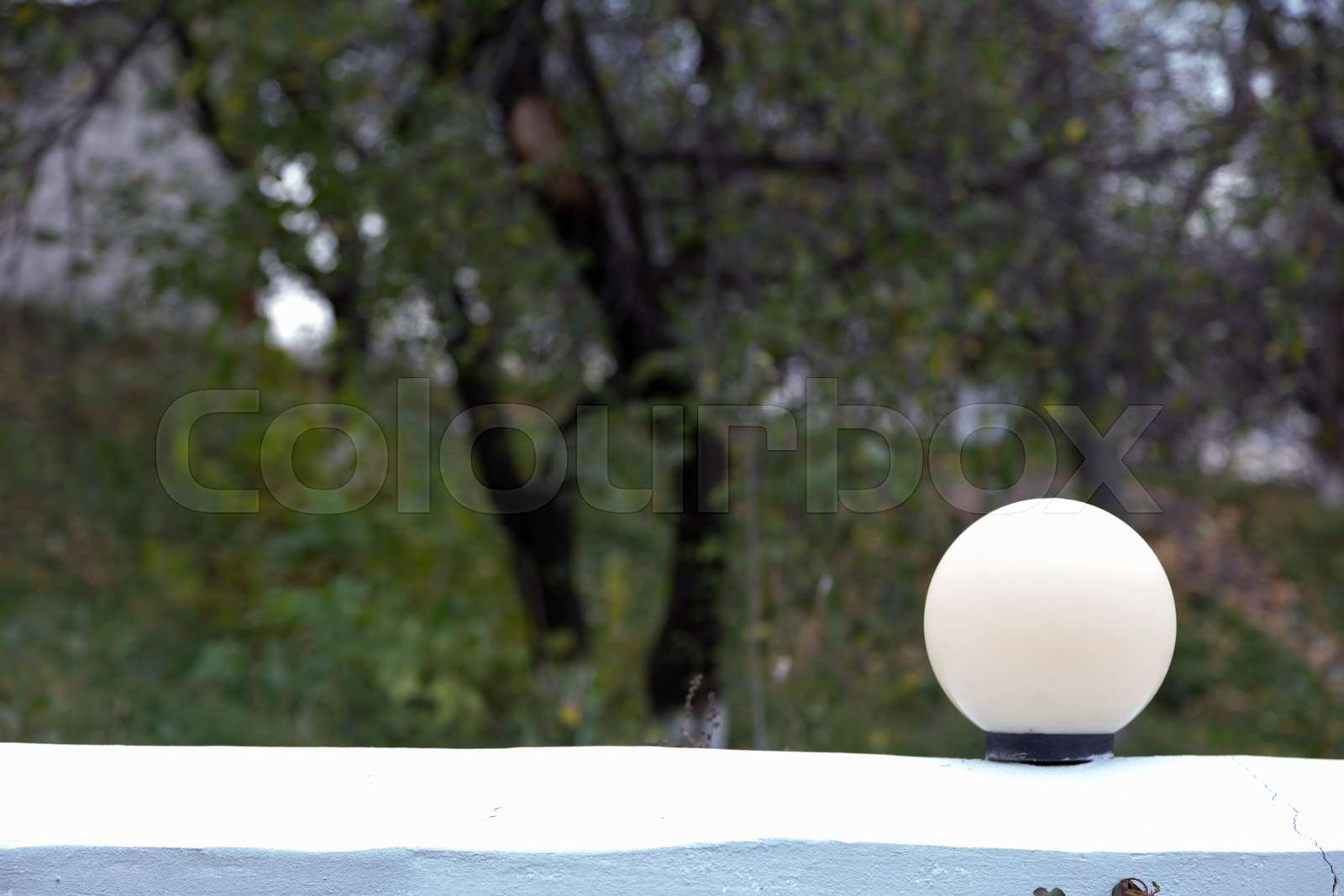White sphere lights mounted on the roadside fence. | Stock image ...