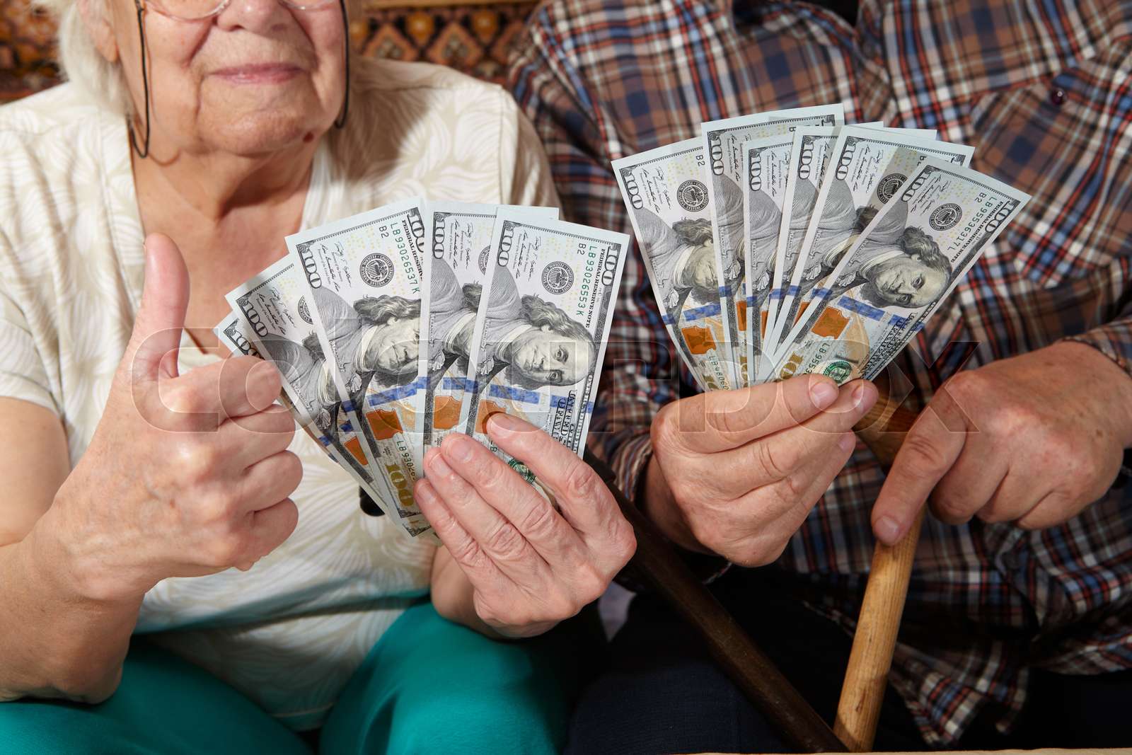 Old couple and money. | Stock image | Colourbox