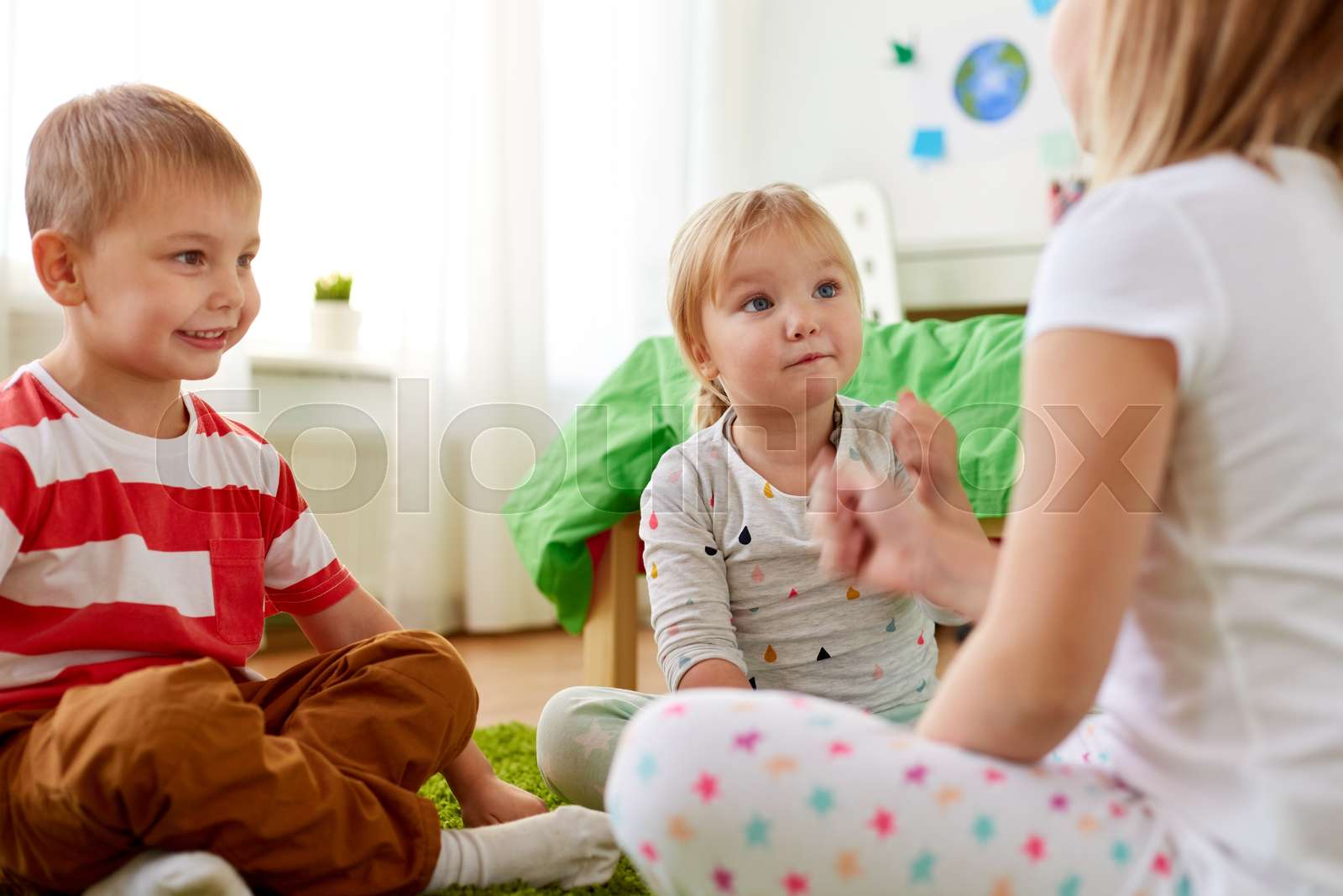 kids playing rock-paper-scissors game at home | Stock image | Colourbox
