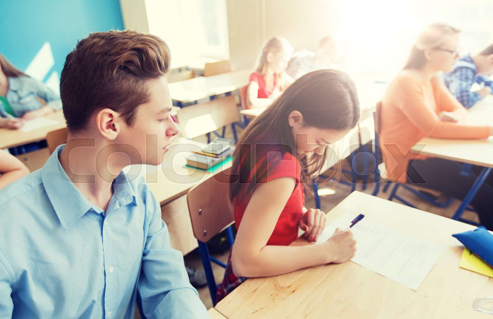 group of students writing school test | Stock image | Colourbox