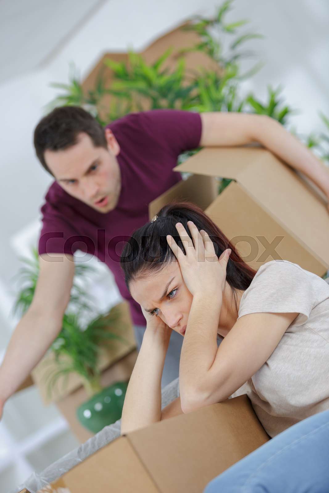 sad evicted woman worried moving houses | Stock image | Colourbox