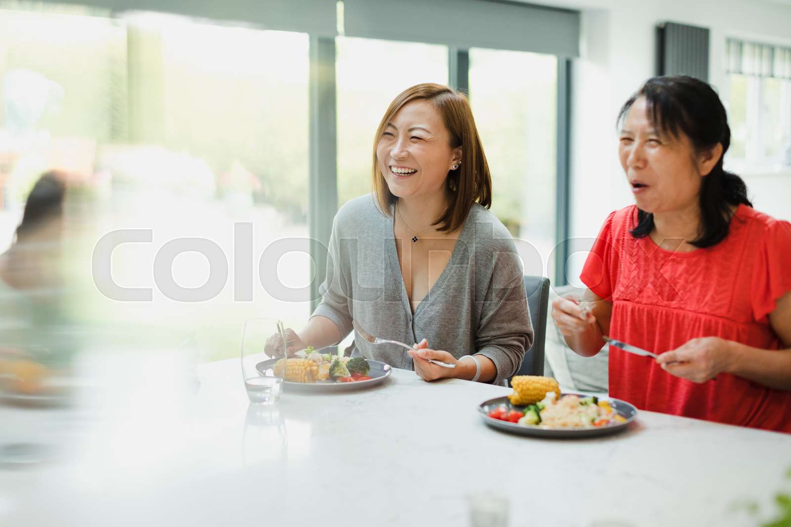 Women Enjoying a Family Dinner at Home | Stock image | Colourbox