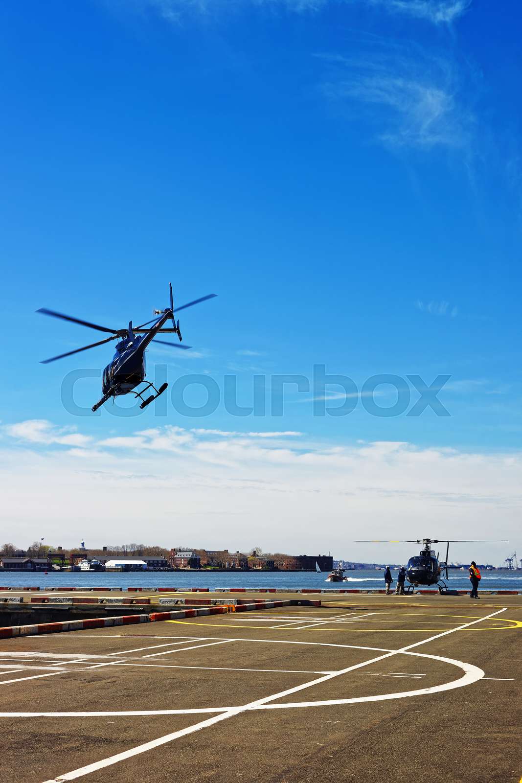 Black Helicopter taking off from helipad in Lower Manhattan USA | Stock ...