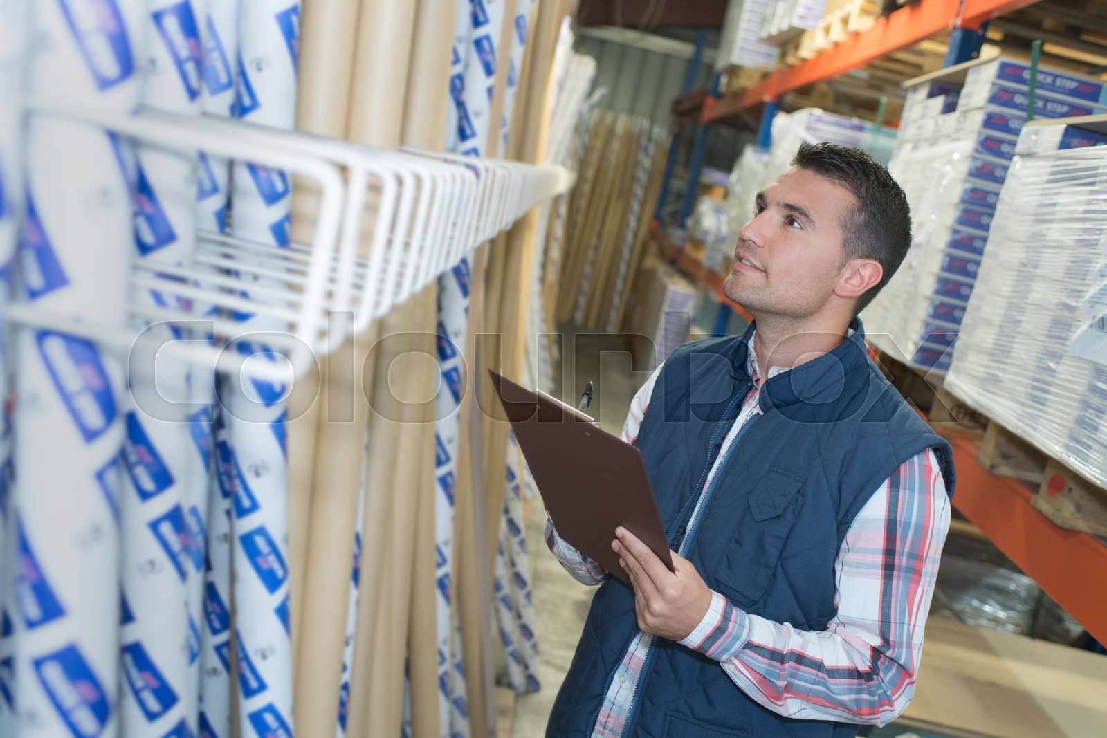 happy worker man with inventory | Stock image | Colourbox