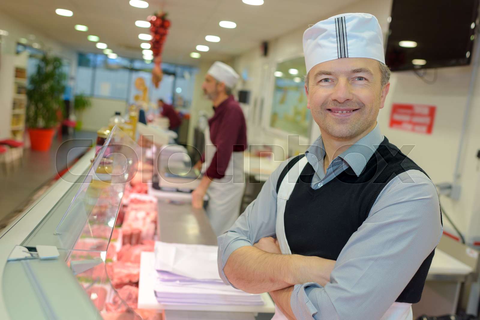 portrait of happy male butcher in kosher section at supermarket | Stock ...