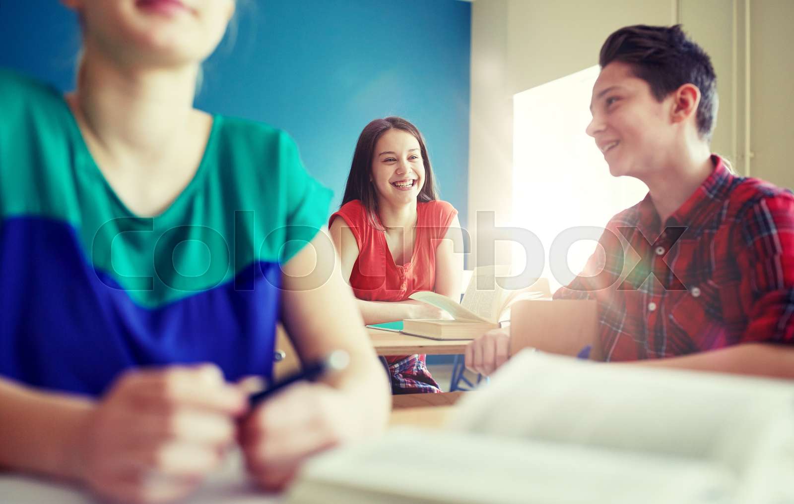 group of happy students talking at school break | Stock image | Colourbox