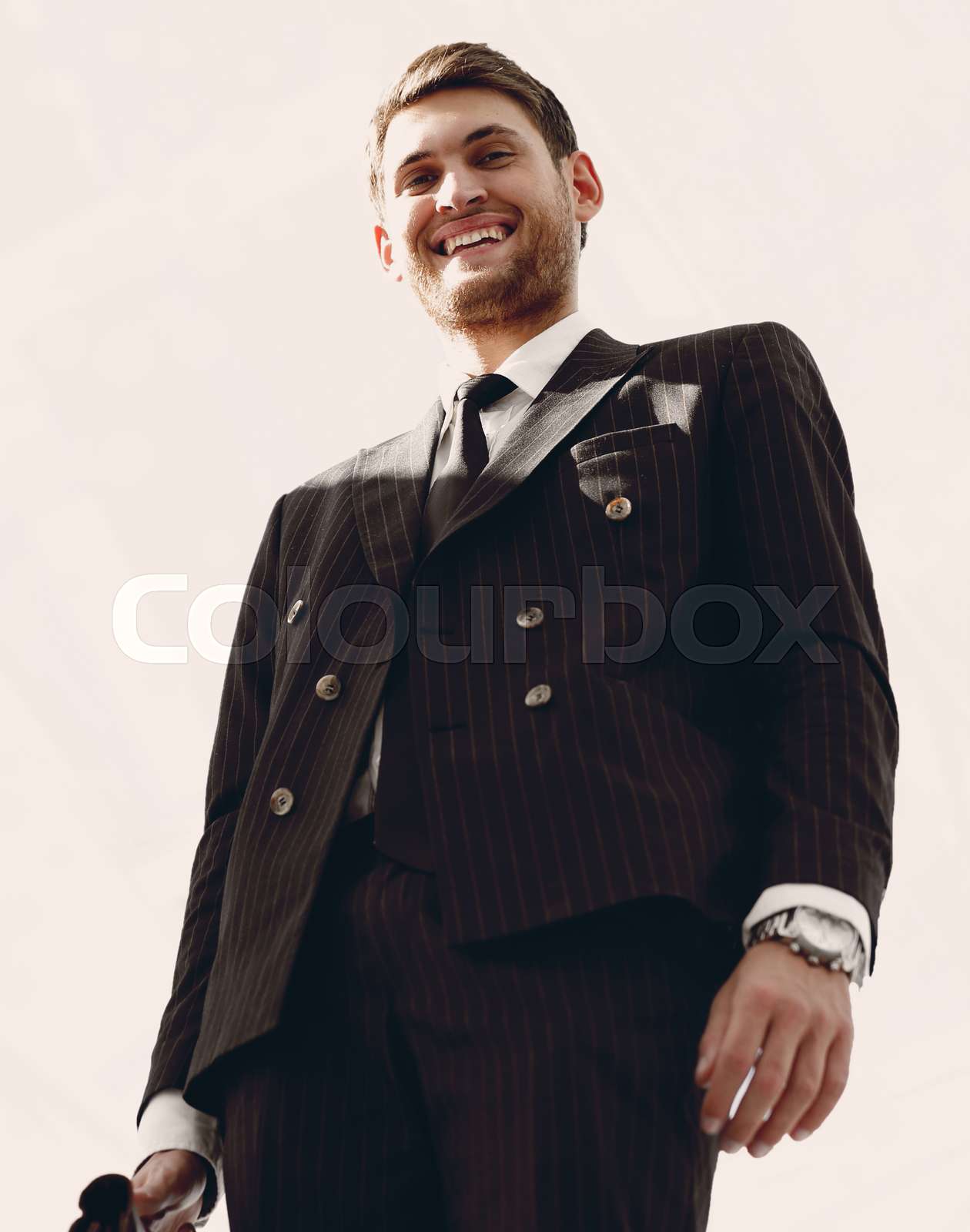bottom view. successful businessman looking at the camera. | Stock ...