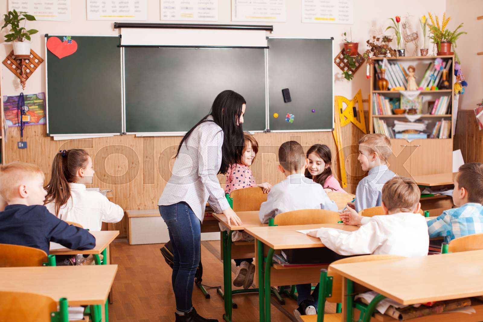 Teacher starts the lesson | Stock image | Colourbox