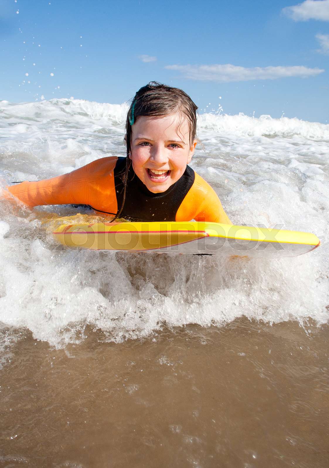 Little girl Bodyboarding in the Sea | Stock image | Colourbox