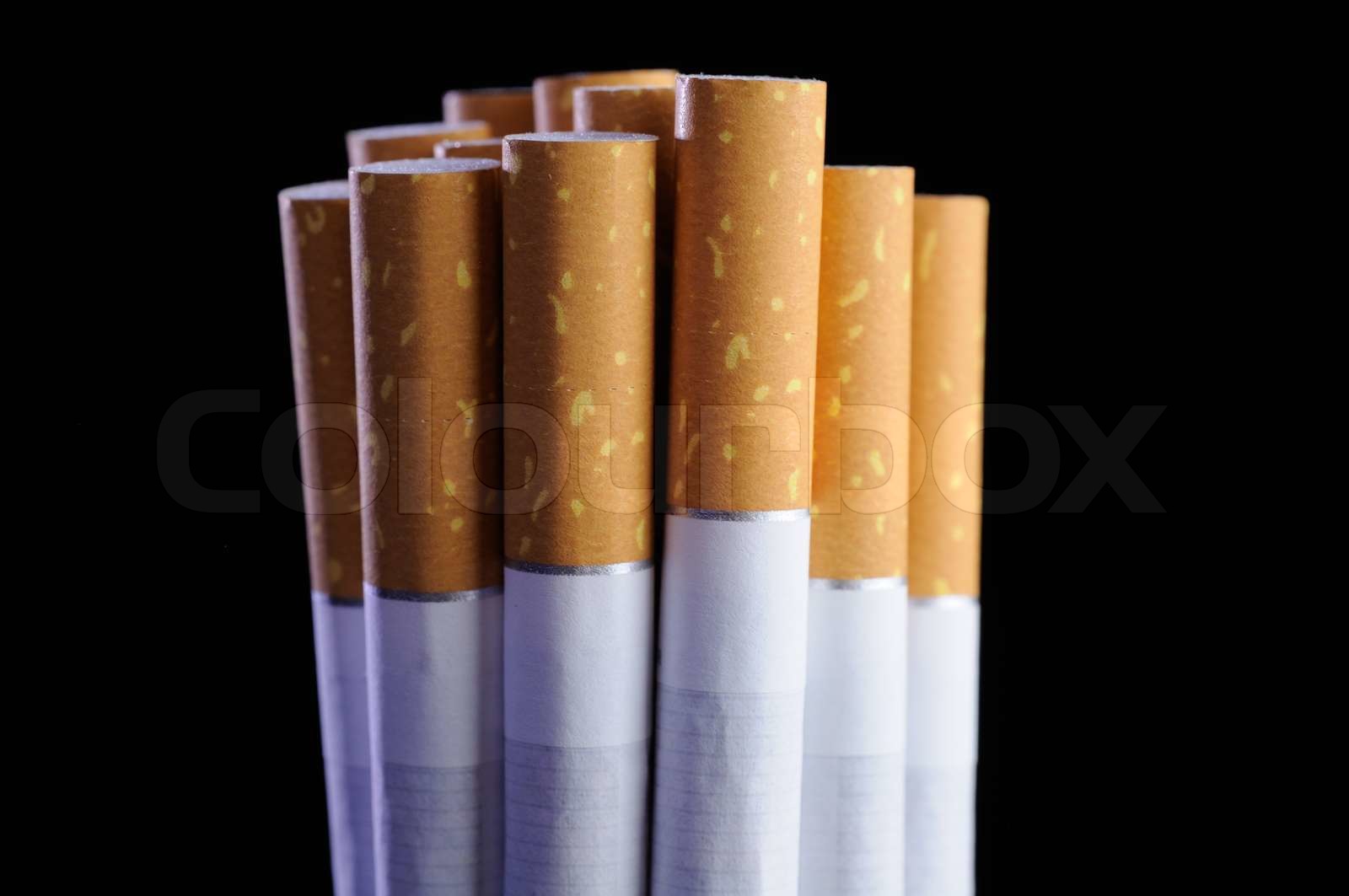 Bunch of Cigarettes on Black Background | Stock image | Colourbox