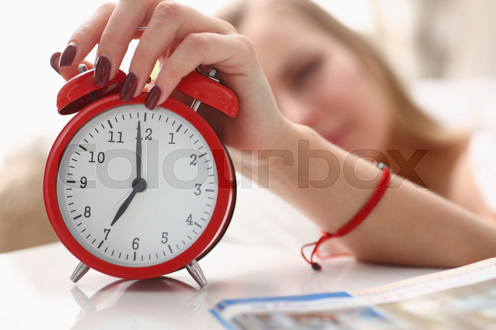 Young beautiful woman waking up in the morning alarm | Stock image ...