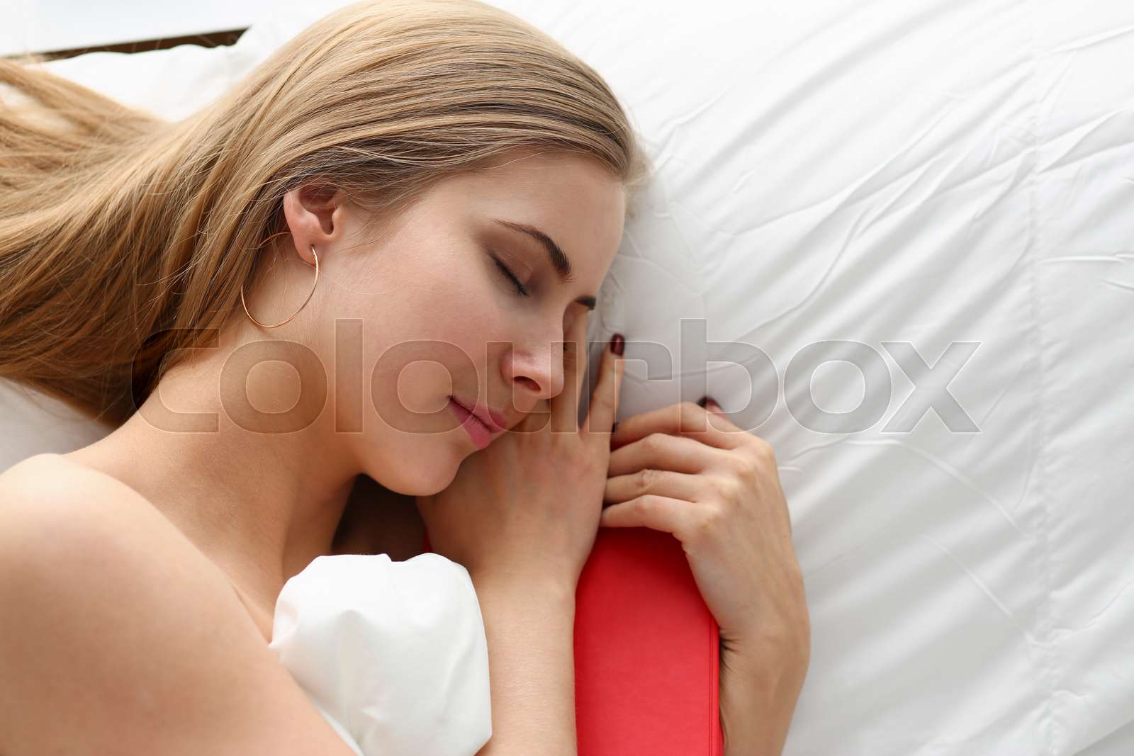woman fall asleep with book stay in bed | Stock image | Colourbox