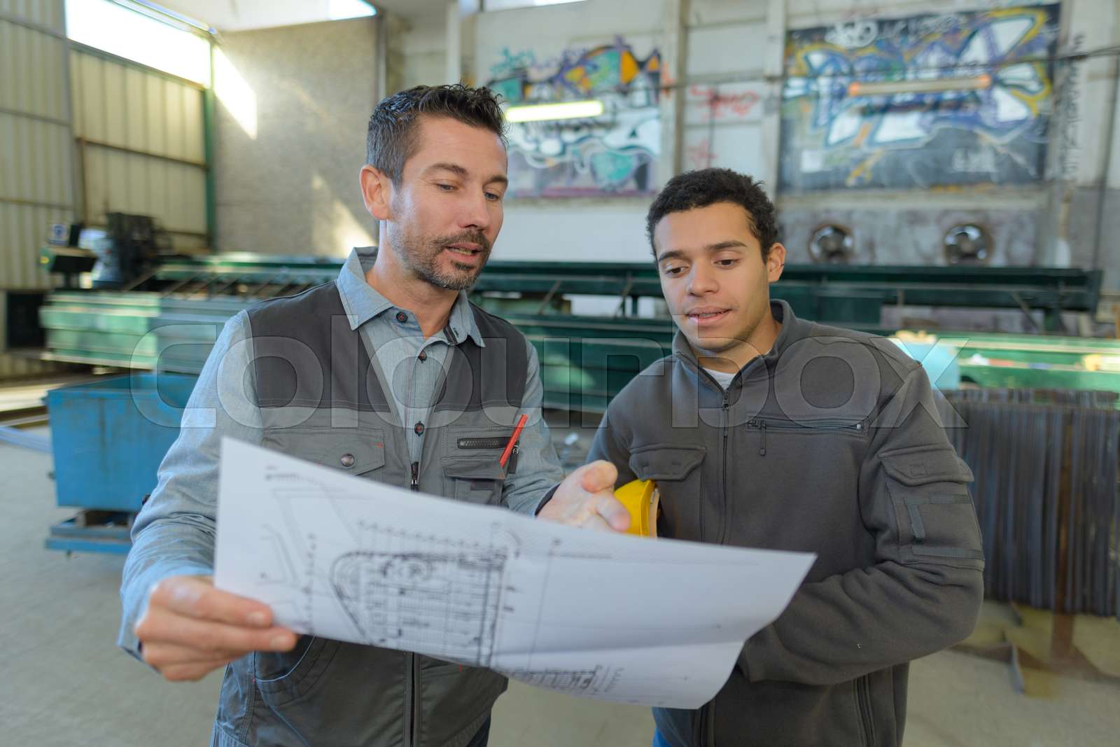 site inspector making inspection report in big industrial hall | Stock ...