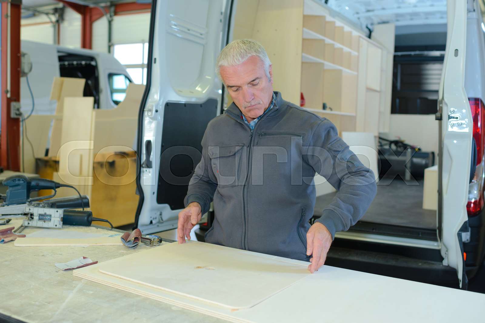 man making cabinet shelving | Stock image | Colourbox