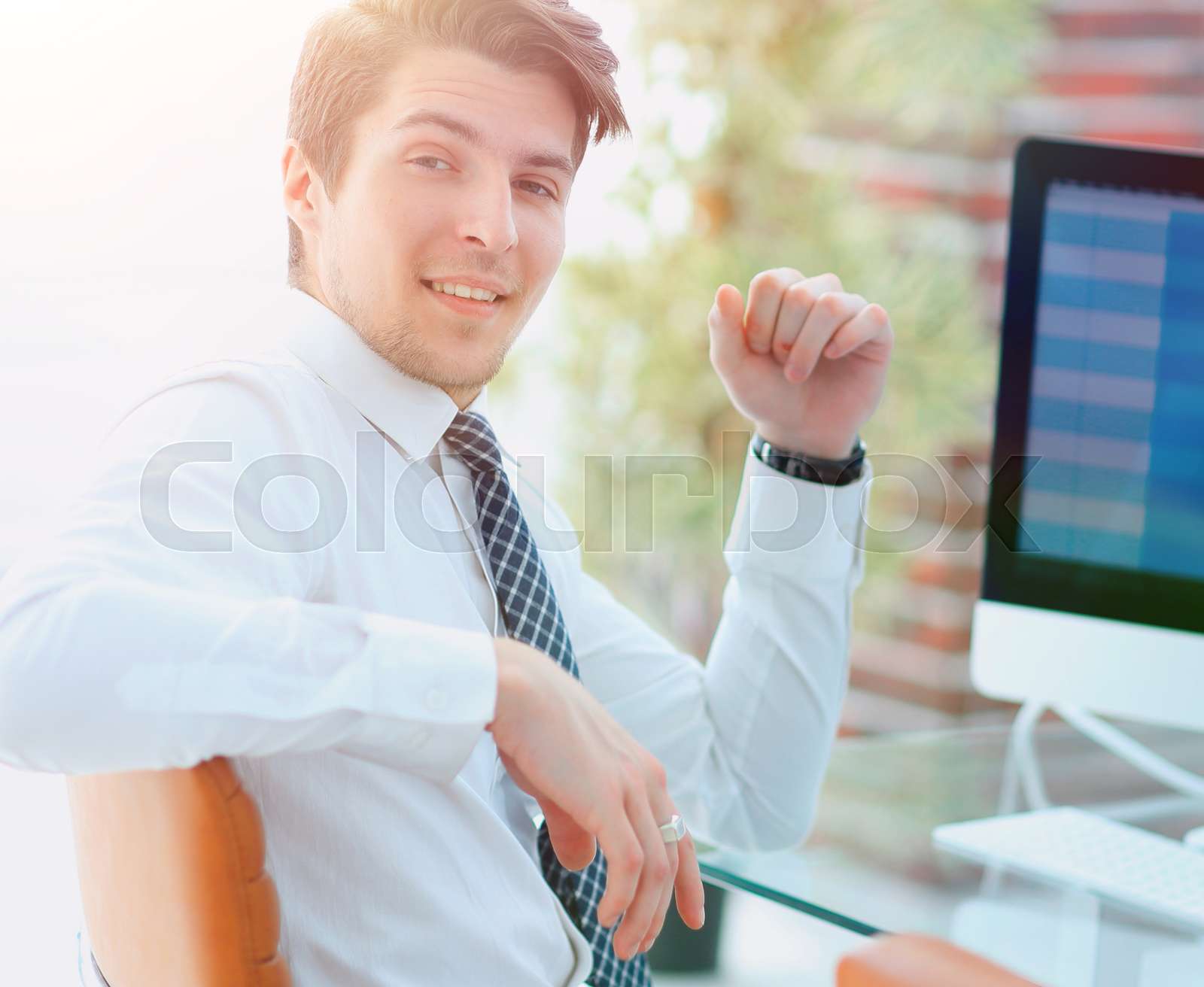 employee sitting in front of a computer screen | Stock image | Colourbox