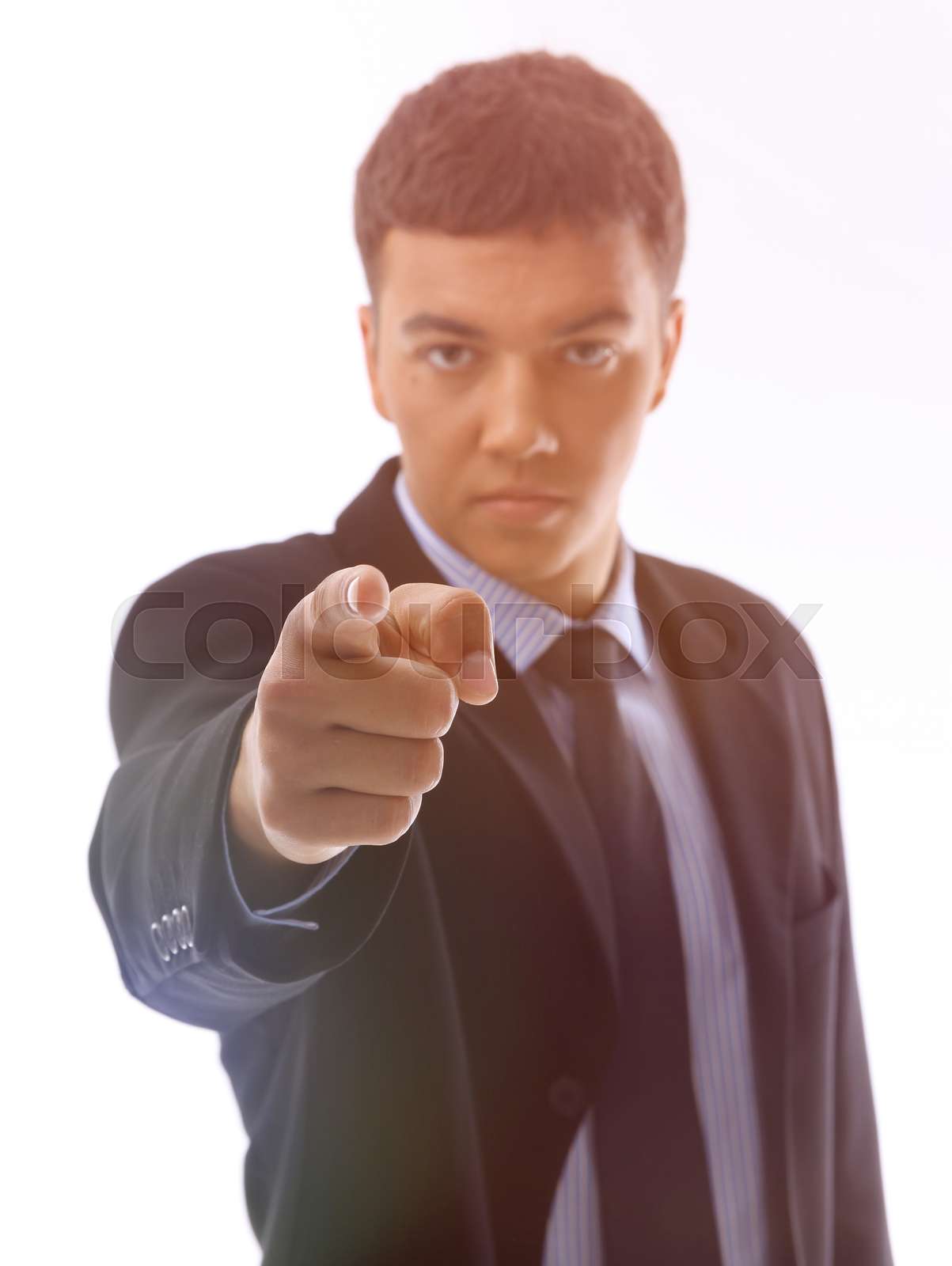serious businessman pointing his finger forward | Stock image | Colourbox