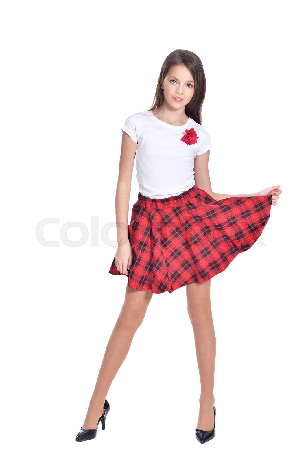 Happy little girl wearing high heels posing isolated | Stock image ...