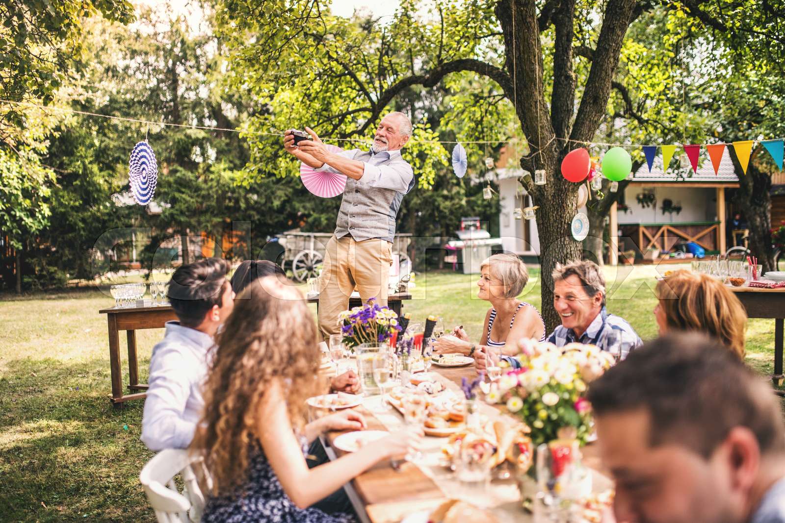 Family celebration or a garden party outside in the backyard. | Stock ...