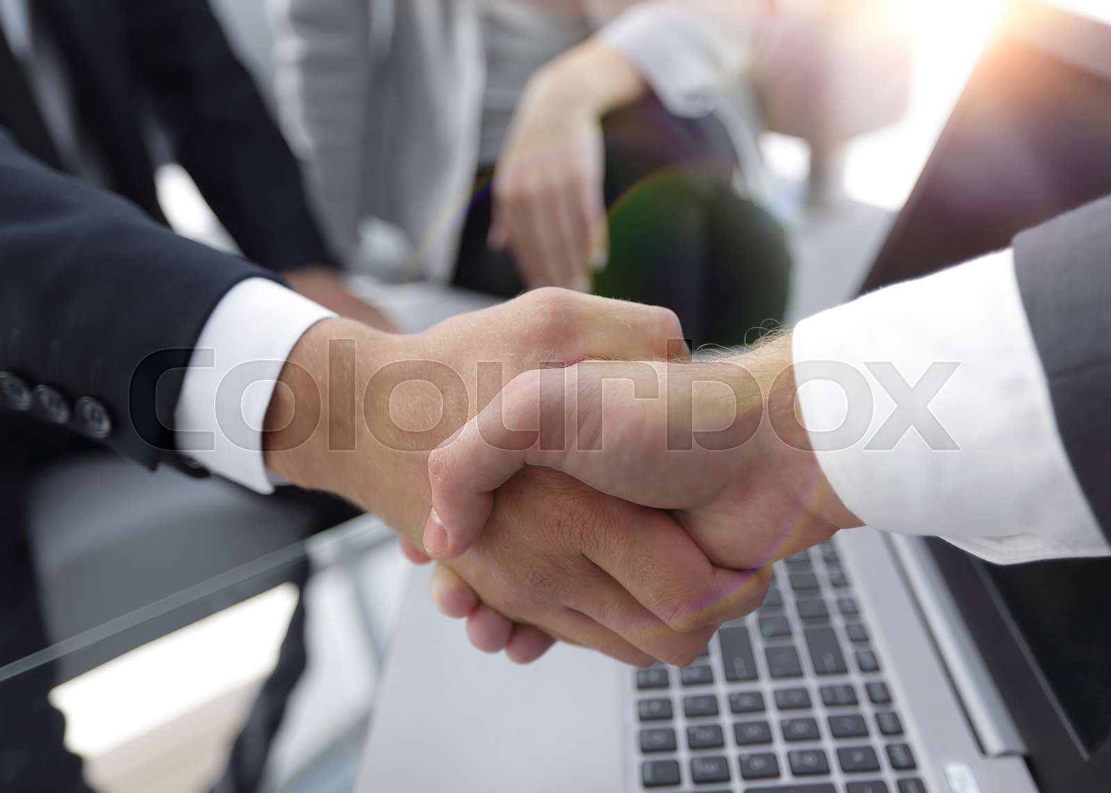 Two confidence businessman shaking hands close-up | Stock image | Colourbox