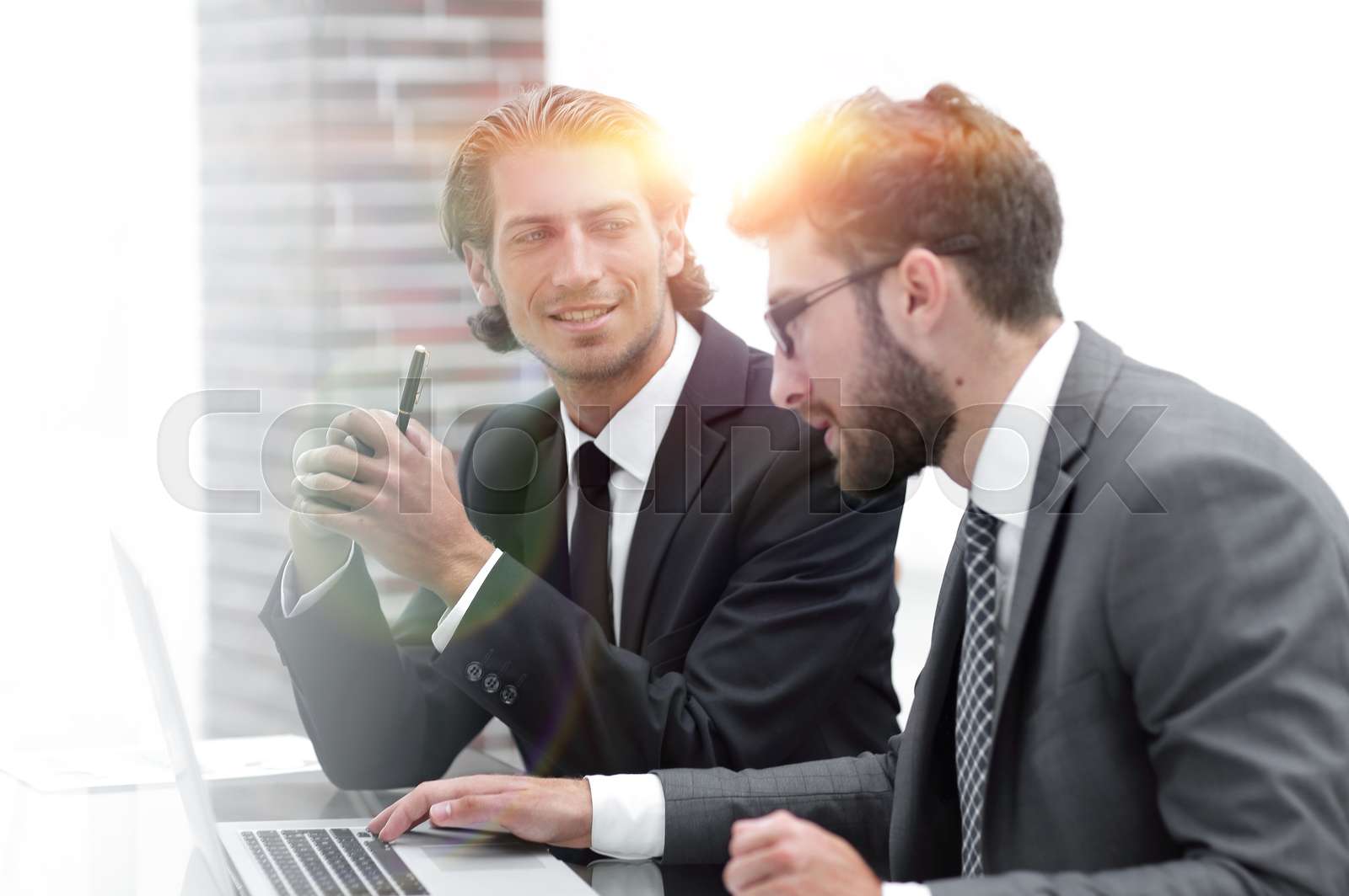 two clerks sitting at their Desk. | Stock image | Colourbox