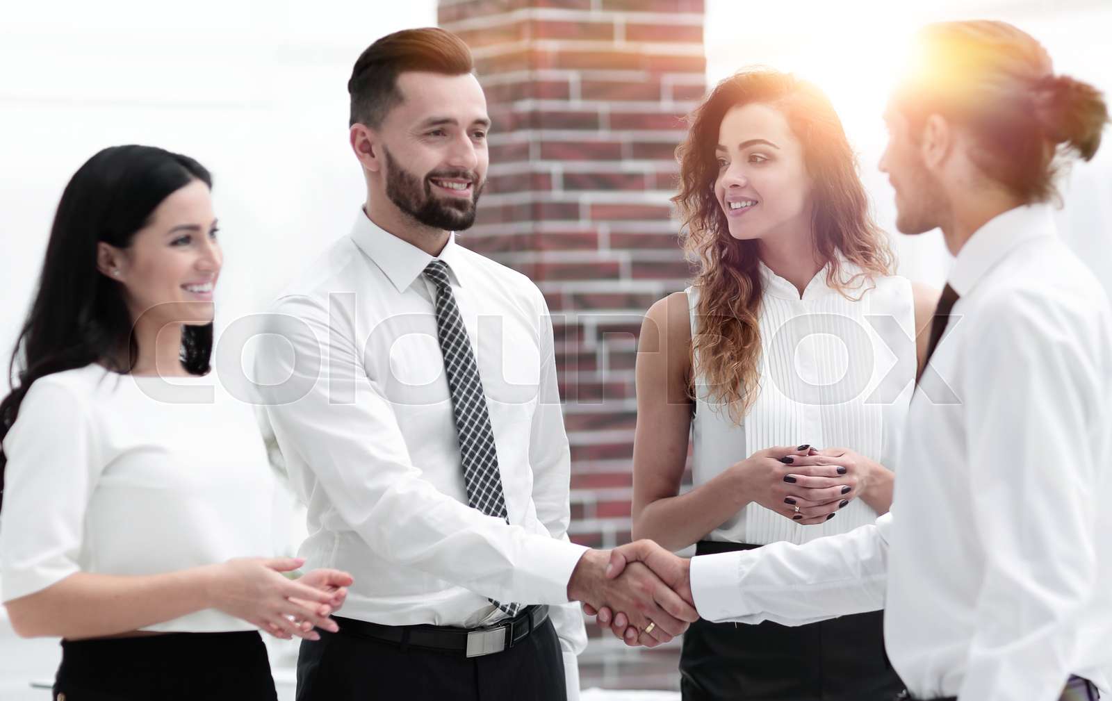 welcome and handshake business partners. | Stock image | Colourbox